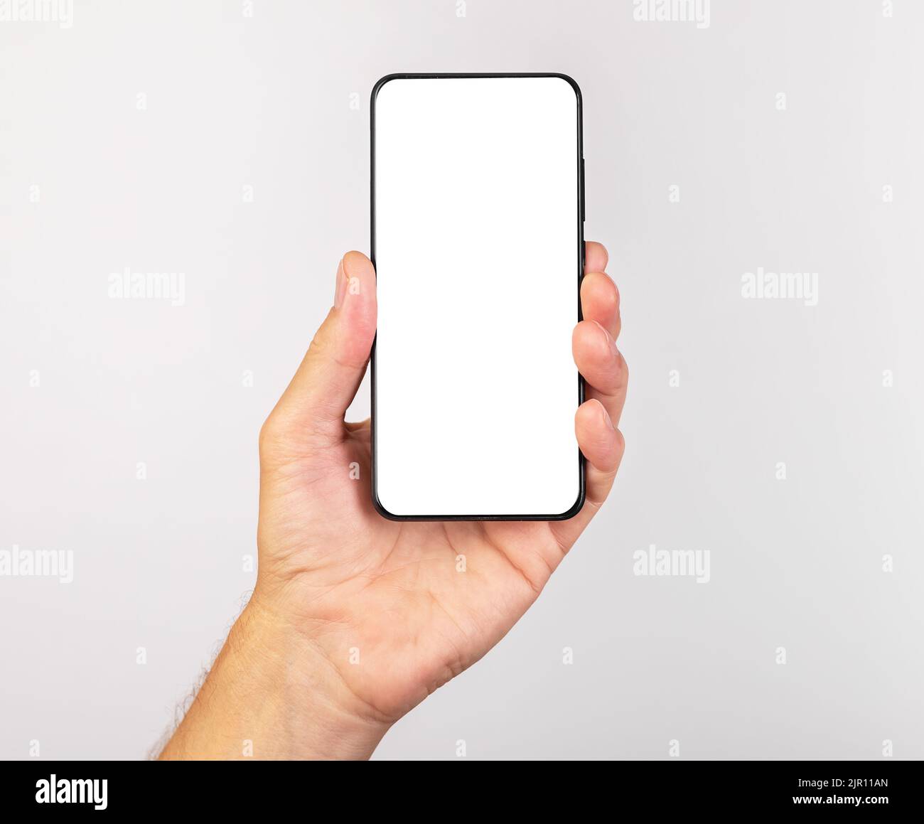 Hand holding phone in vertical position. Woman using for taking Selfie ...