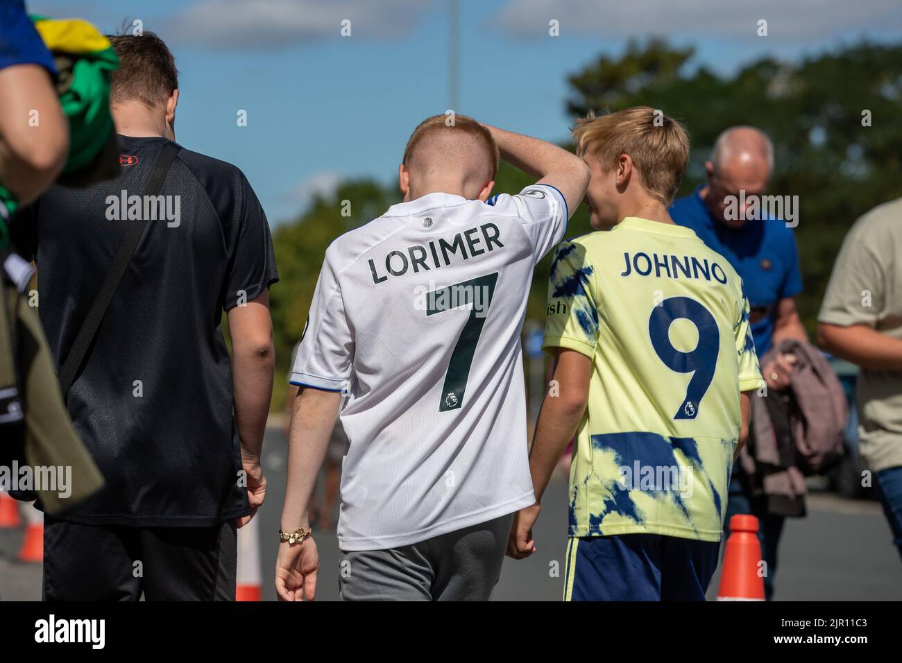 A young Leeds United supporter arrives to Elland Road Stadium wearing a ...