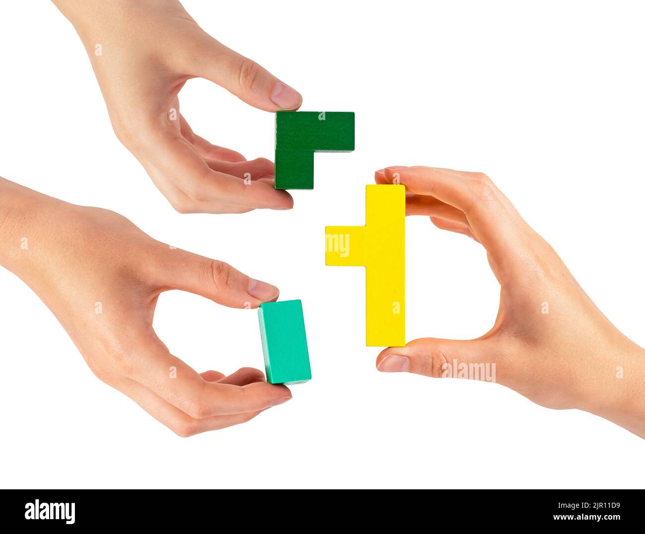Hands connecting puzzle pieces isolated on white background. Teamwork ...