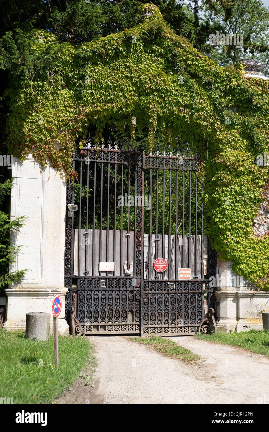 A vertical shot of a closed gate Stock Photo - Alamy