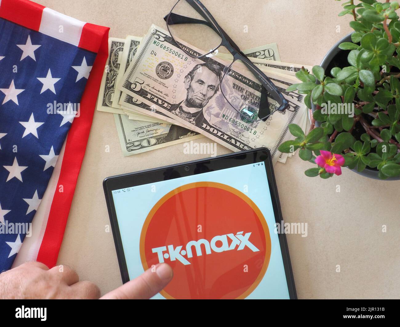 In this photo illustration, TK Maxx logo seen displayed on a tablet ...