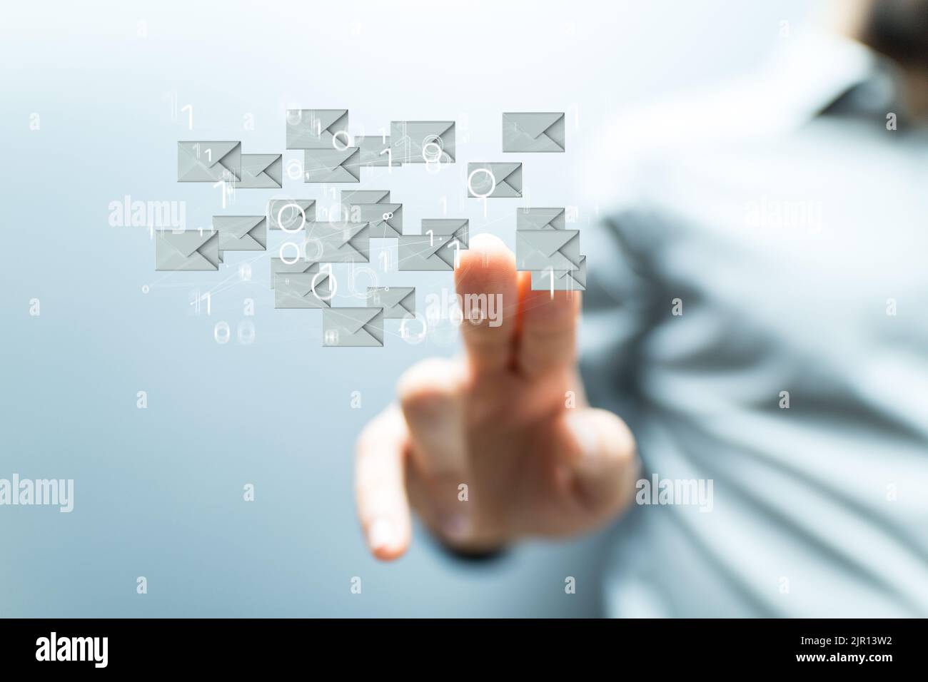 A man tapping a floating 3D-rendered email icons Stock Photo - Alamy