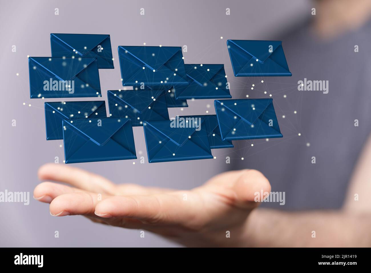 A man holding a floating 3D-rendered email icons Stock Photo - Alamy