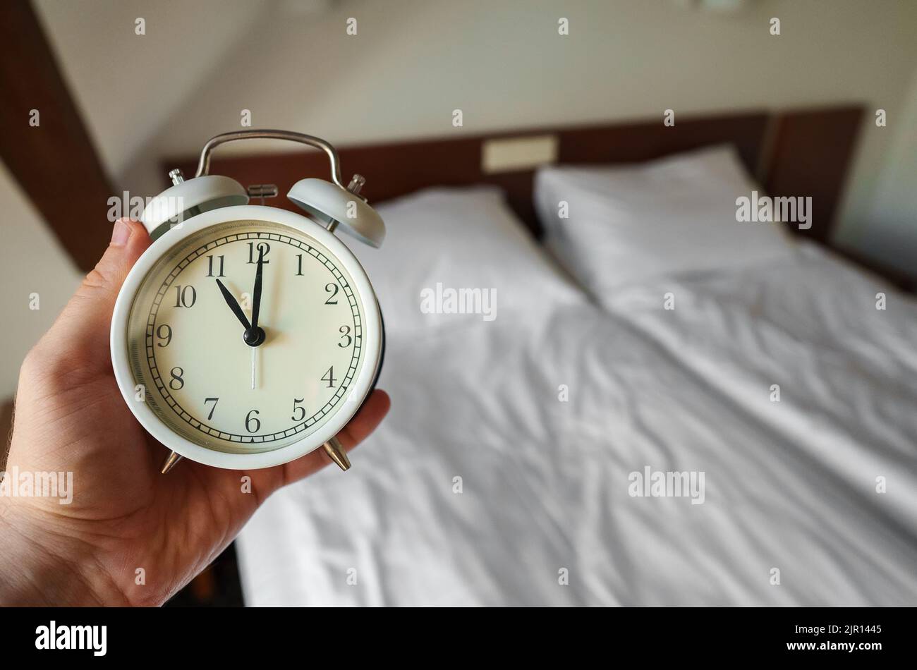 The clock shows 11 am. Time to get up Stock Photo - Alamy