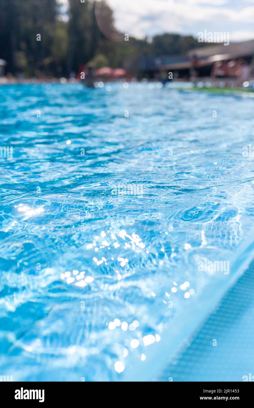 Water background, ripple and flow with waves. Summer blue swiming pool ...