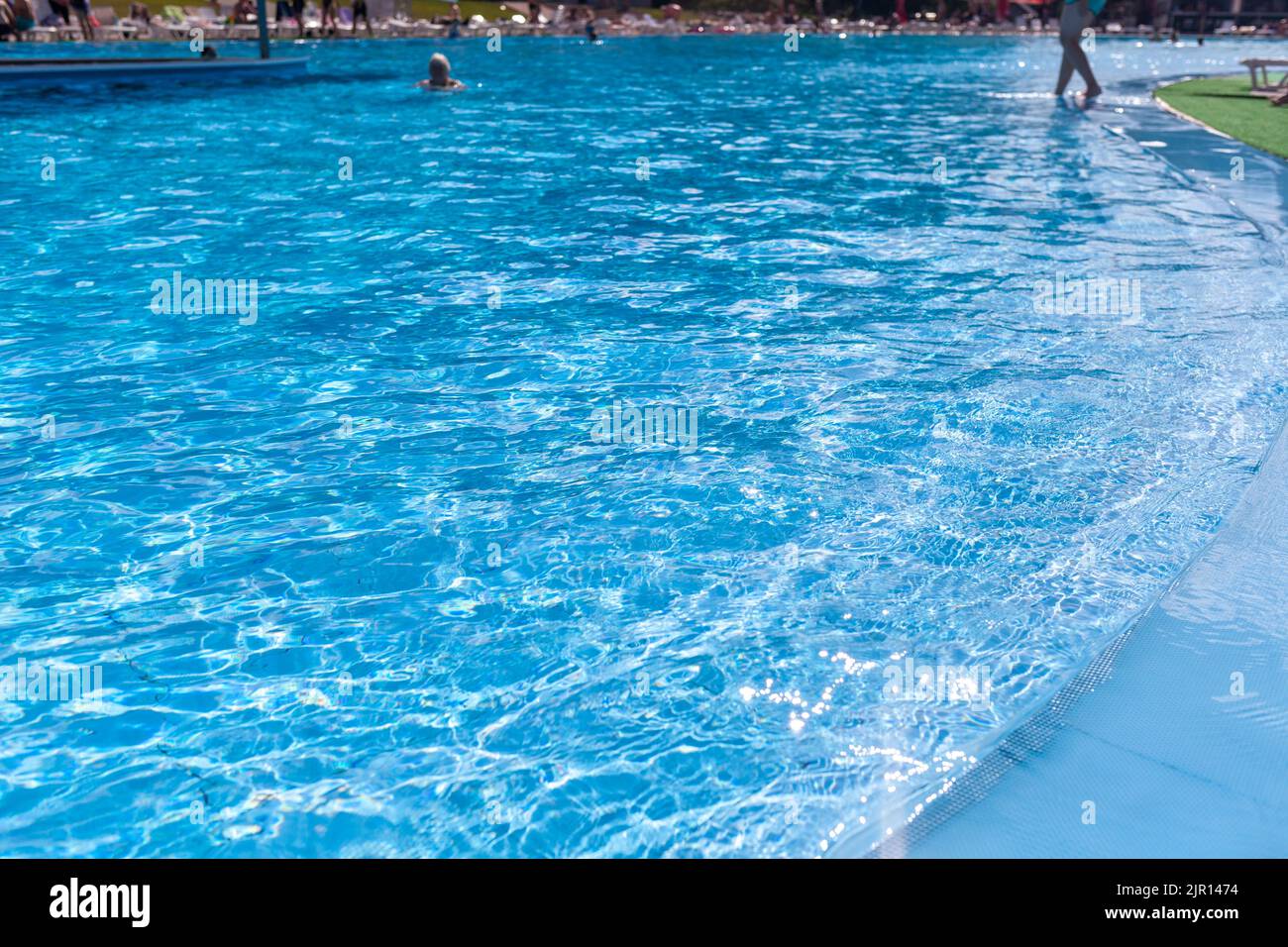 Water background, ripple and flow with waves. Summer blue swiming pool ...