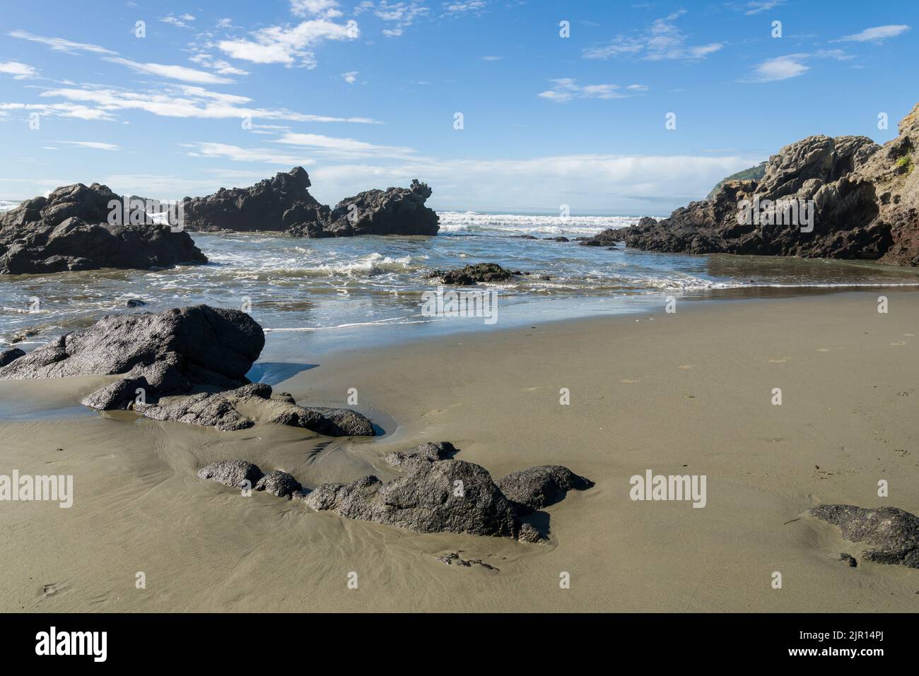 Rocky outcrops at low tide Christchurch New Zealand Stock Photo - Alamy