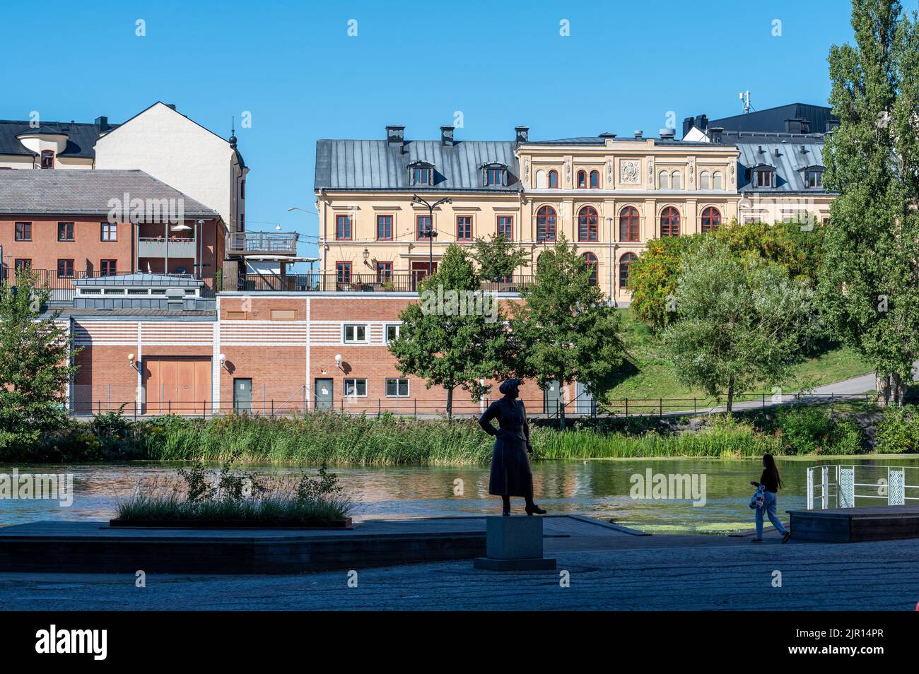 Motala river and the statue of author Moa Martinson by Peter Linde in ...