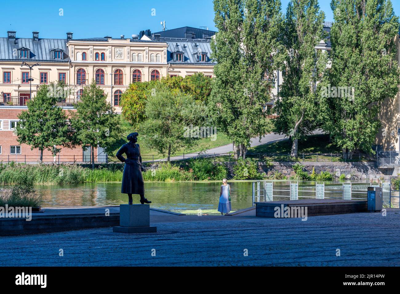Motala river and the statue of author Moa Martinson by Peter Linde in ...