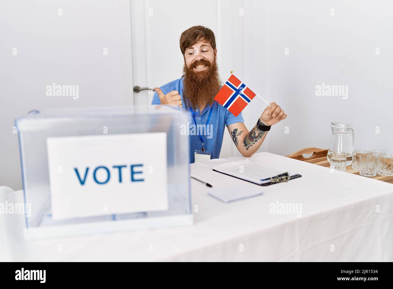 Caucasian man with long beard at political campaign election holding ...