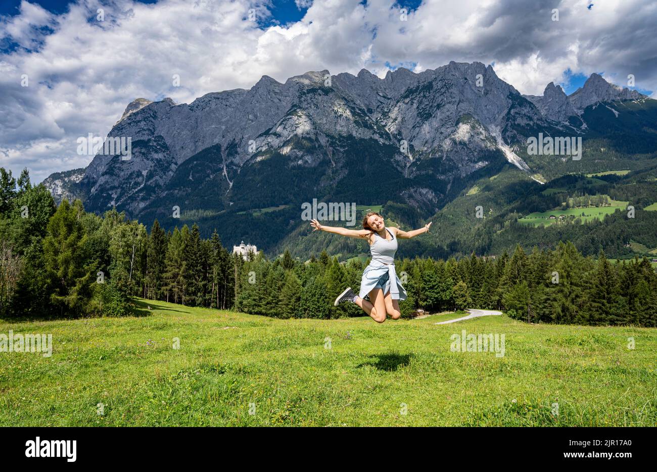 Girl jumping in the air at the meadow on the Sound of Music trail near ...