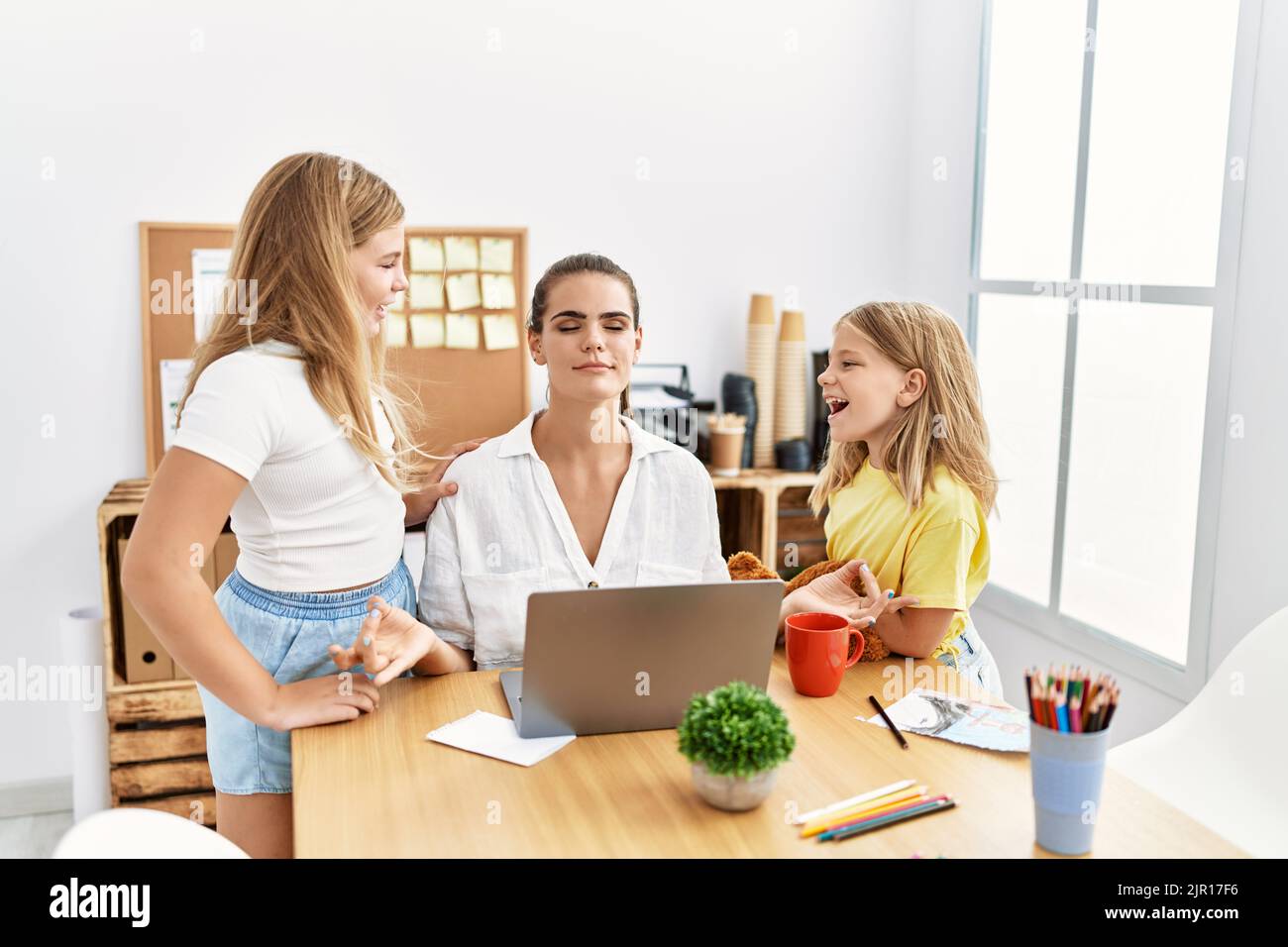 Mother and daughters business worker doing yoga exercise while girls ...