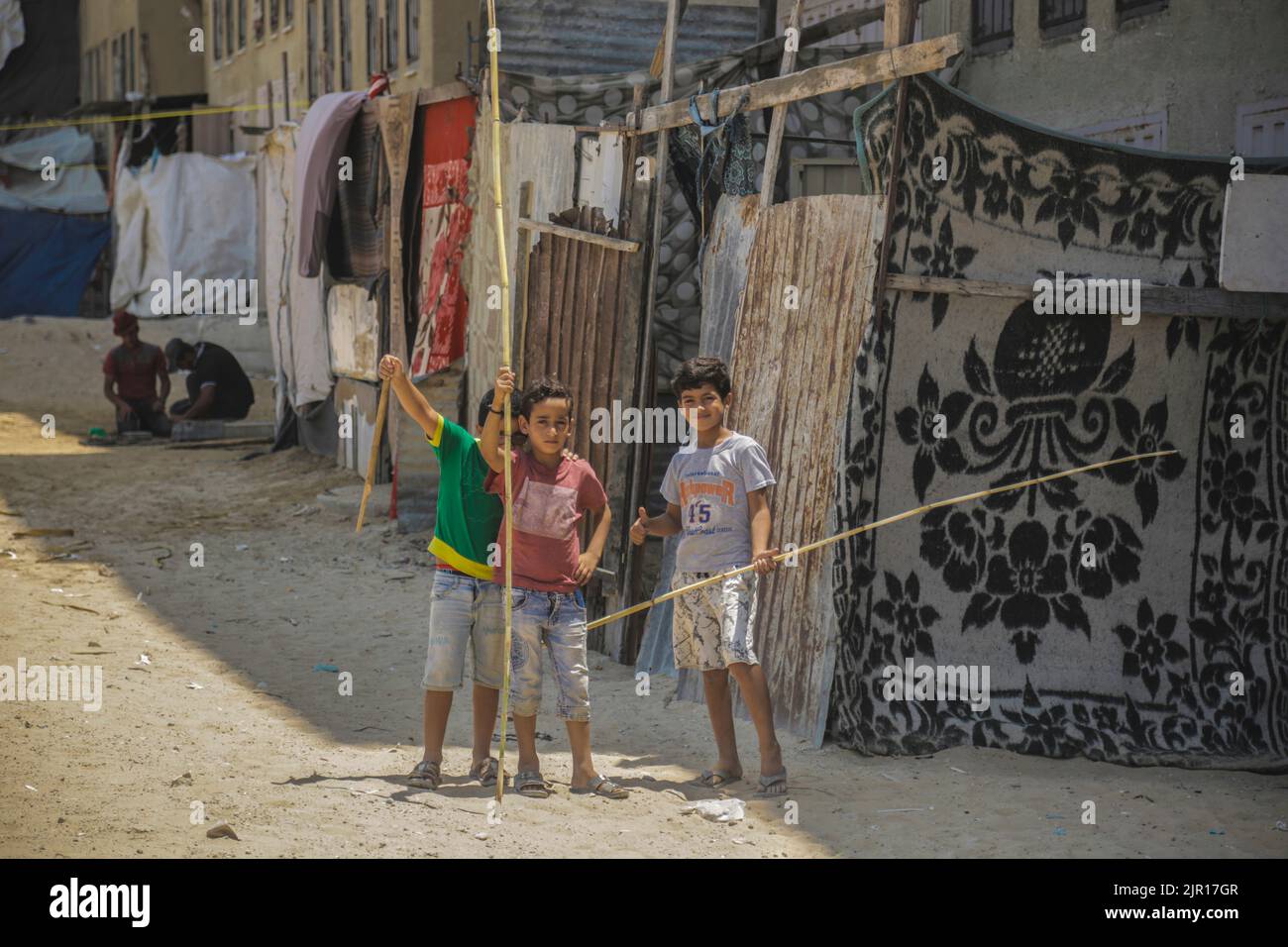 Gaza, Palestine. Three children from Gaza play in front of his house ...