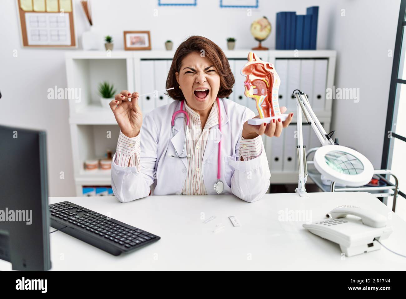 Mature patient doctor nasal swab hi-res stock photography and images ...