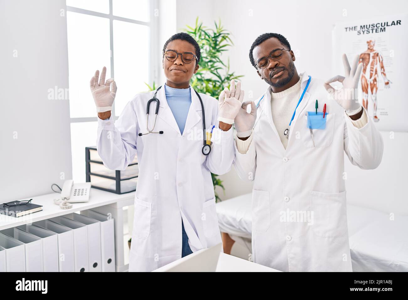 Young african american doctors working at medical clinic relax and ...