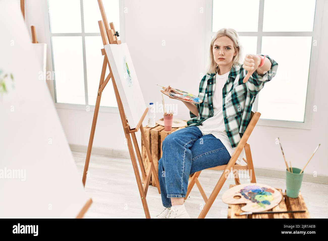 Girl unhappy painting classroom hi-res stock photography and images - Alamy