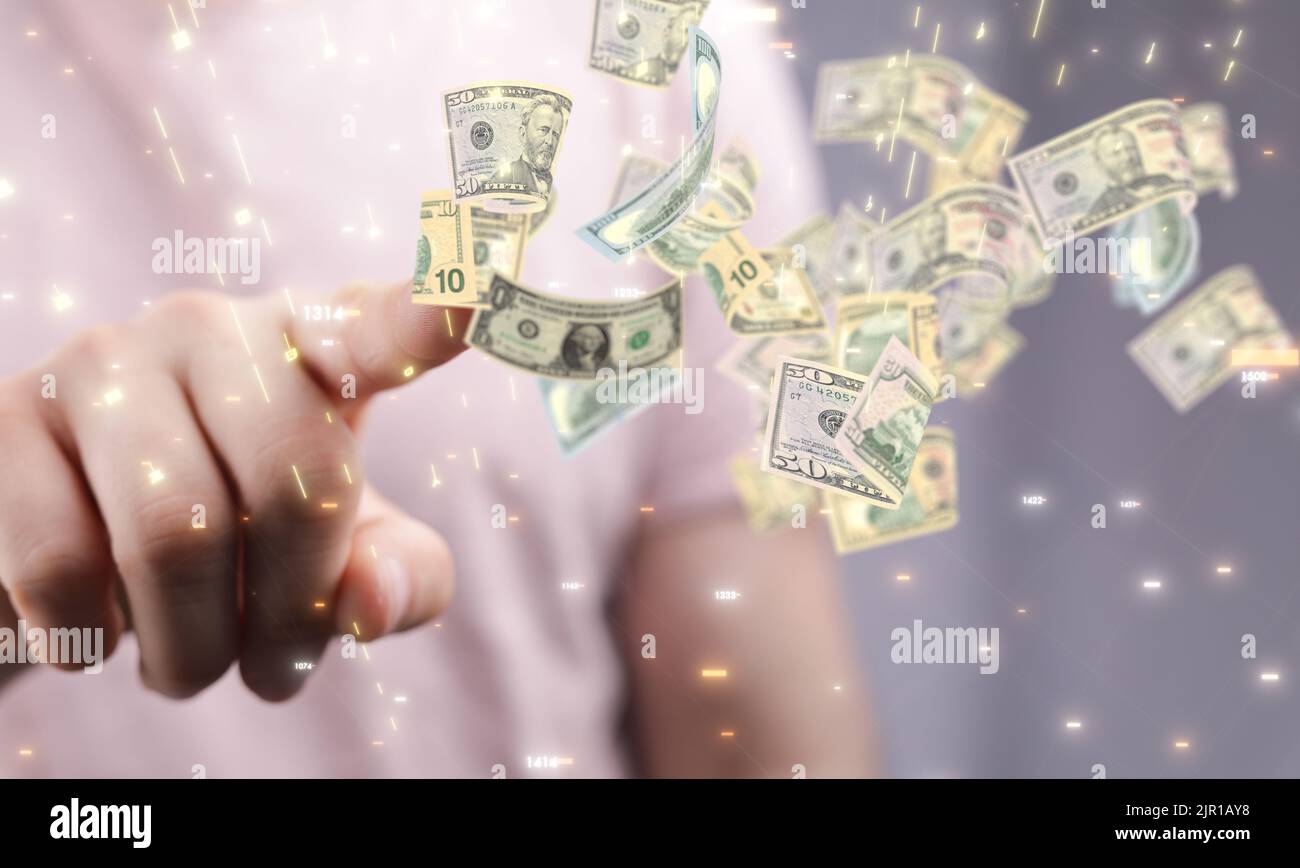A man tapping a floating 3D-rendered money icons Stock Photo - Alamy