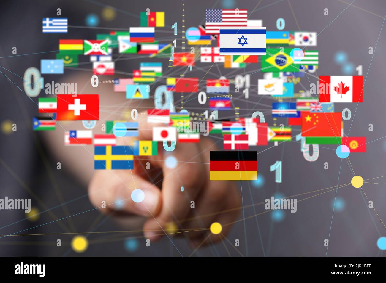 A man tapping a floating 3D-rendered country flags Stock Photo - Alamy