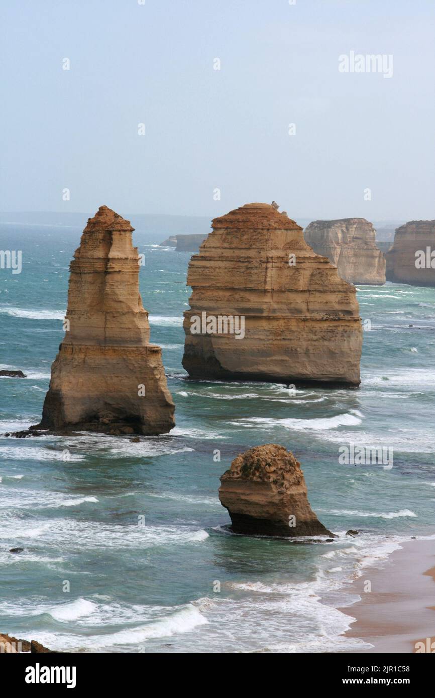 A beautiful scenery of rock formations on the beach surrounded by the ...