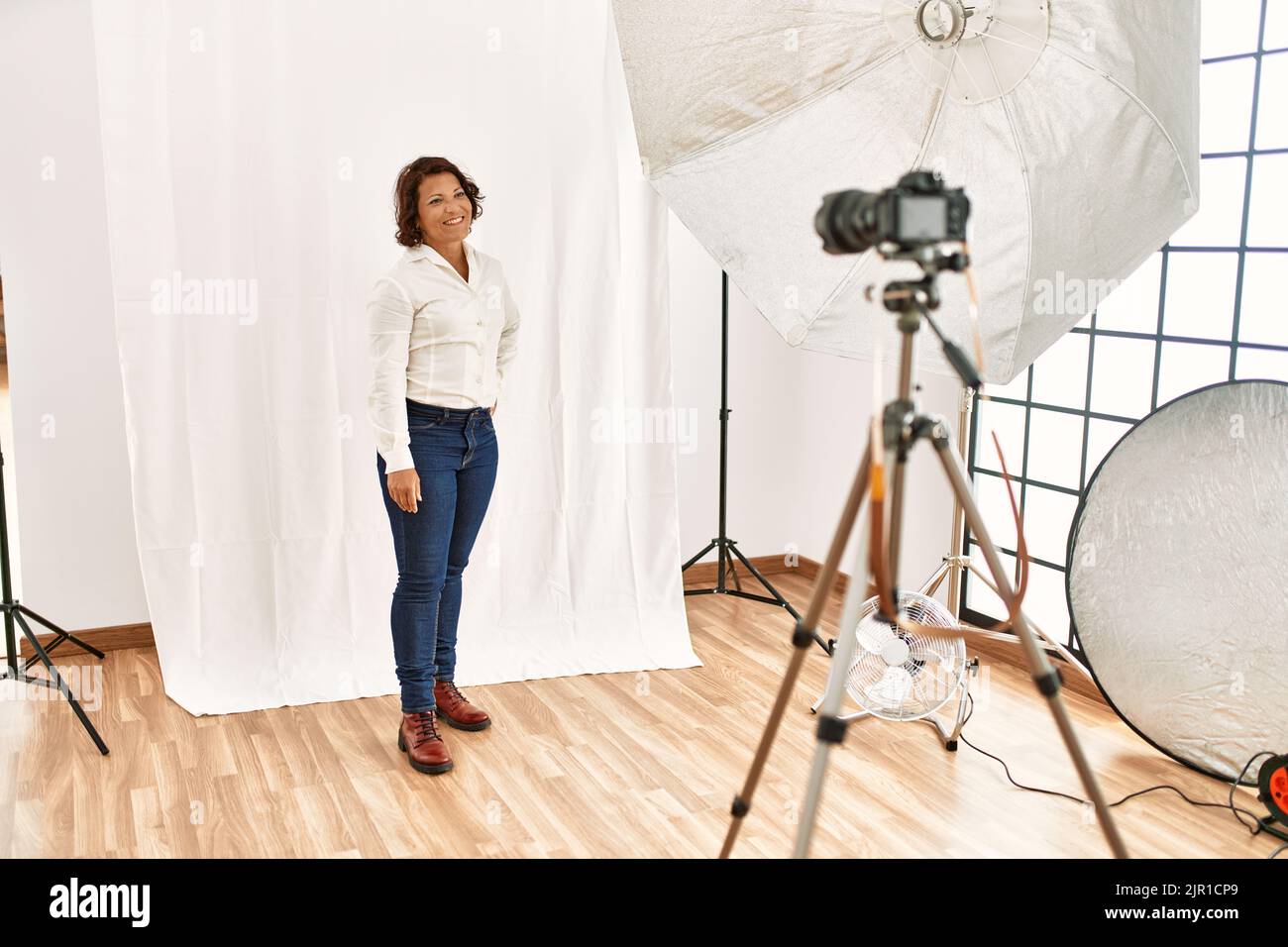 Beautiful model posing front professional camera at studio Stock Photo ...