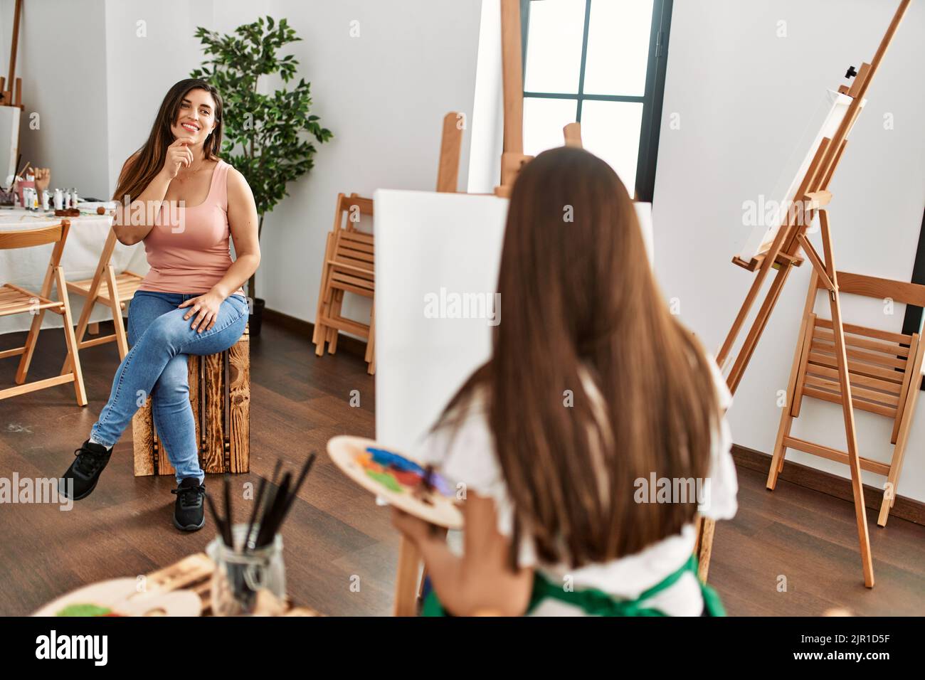 Back view portrait of artist painting at art studio Stock Photo - Alamy