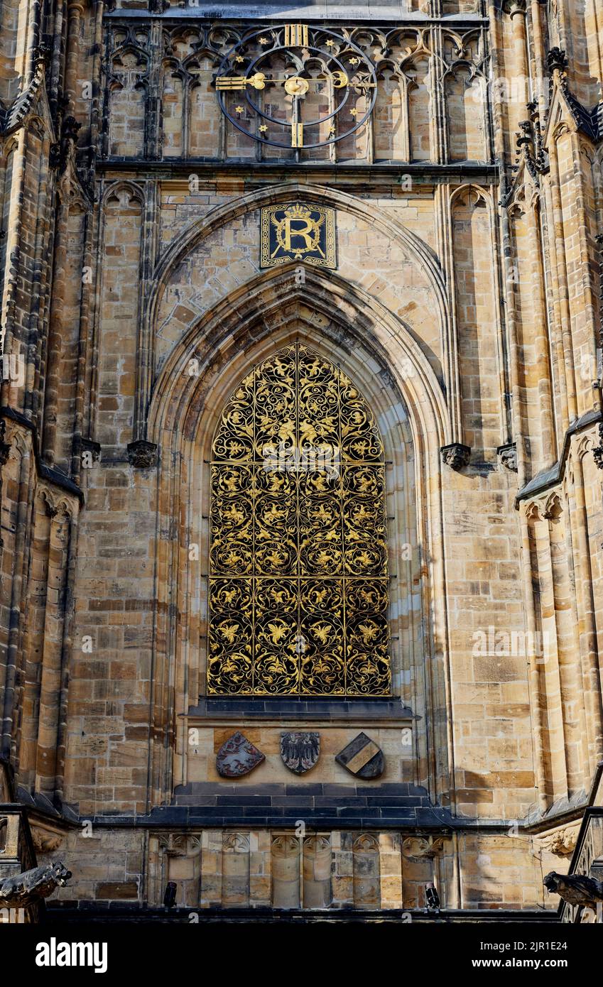 A vertical shot of the Golden Gate of St. Vitus cathedral in Prague ...