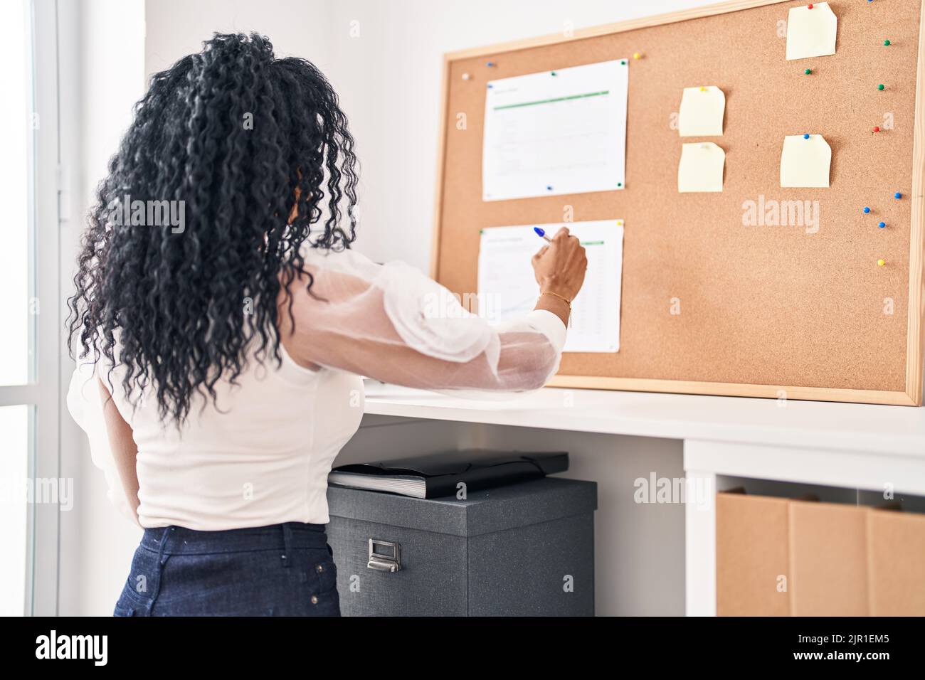 Woman writing on back board hi-res stock photography and images - Alamy