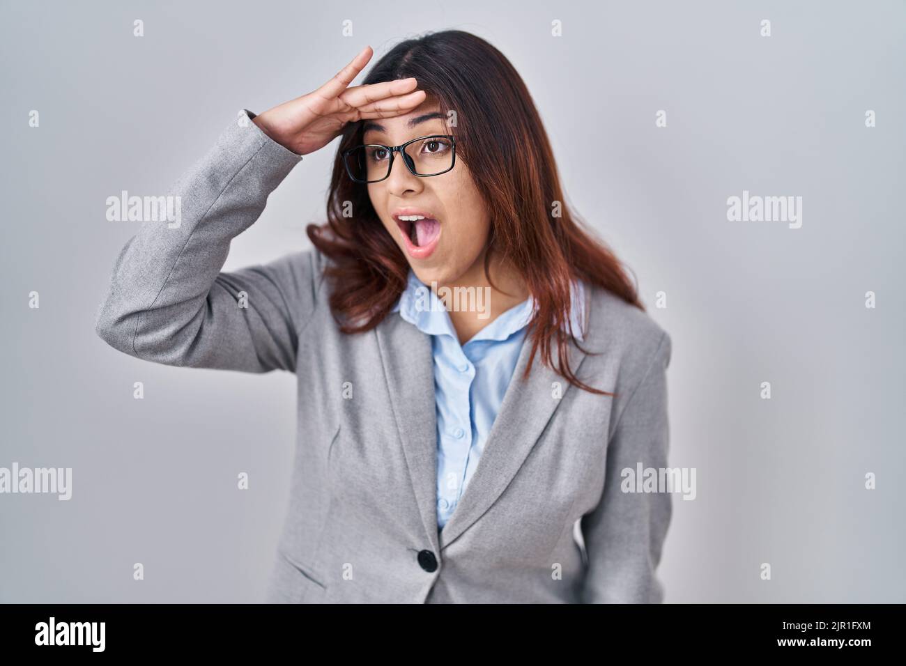 Hispanic young business woman wearing glasses very happy and smiling ...