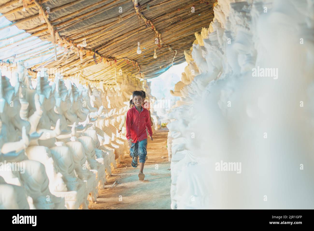 Pileru, India - July 28,2022:Kid running forward with smile.Happy kid ...