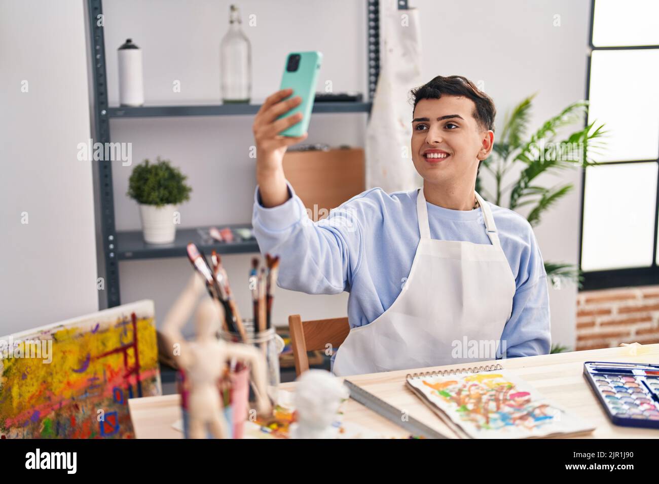 Young non binary man artist smiling confident make selfie by smartphone ...
