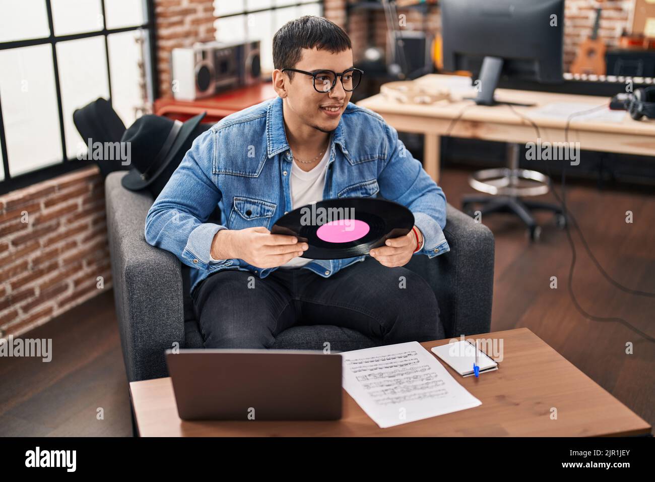 Attractive young man hoding hi-res stock photography and images - Alamy