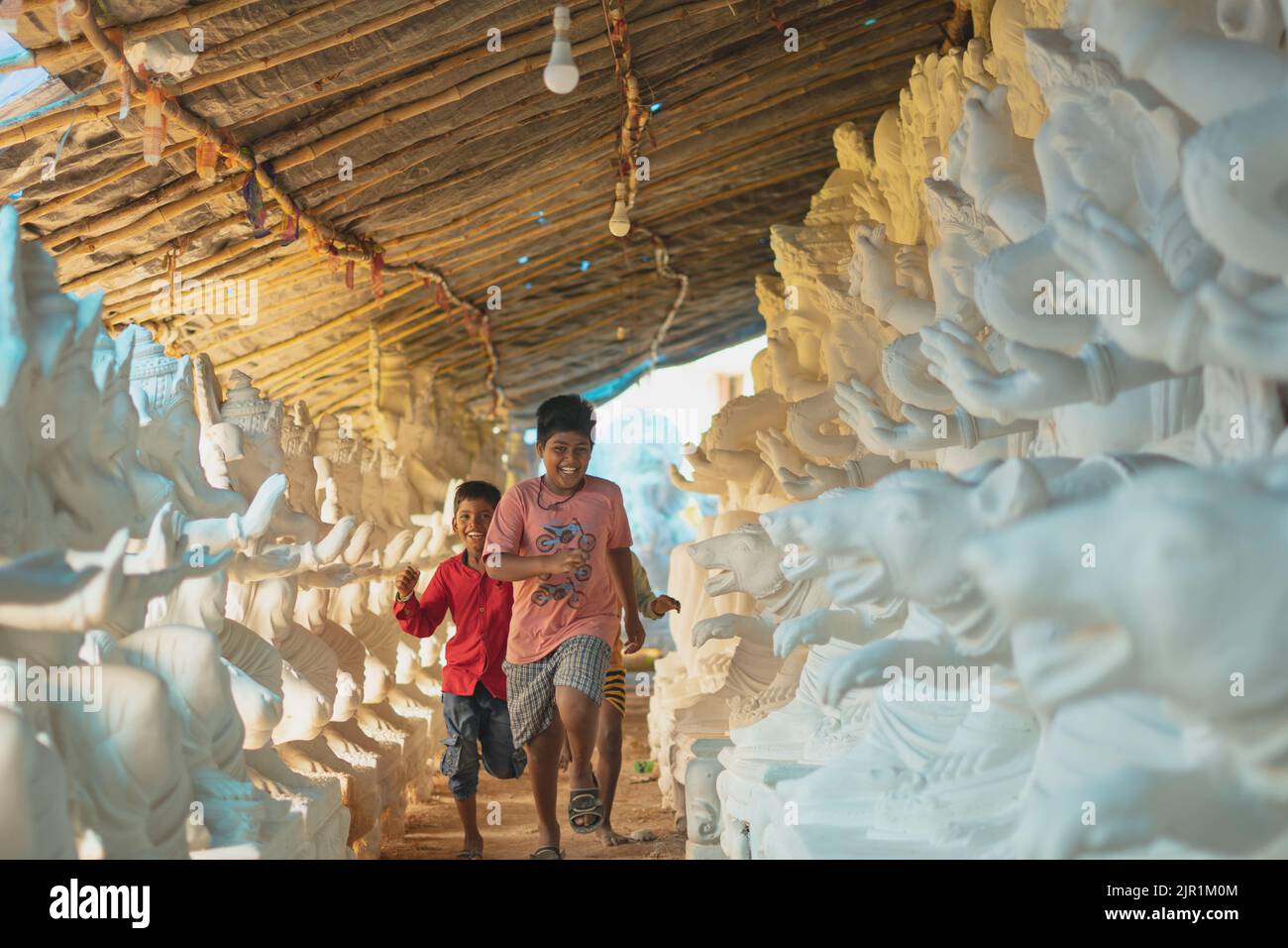 Pileru, India - July 28,2022:Enjoying kids running next to ganesha ...