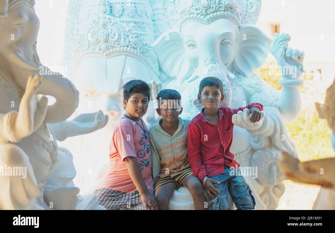 Pileru, India - July 28,2022:Three kids in front of lord venkateswara ...