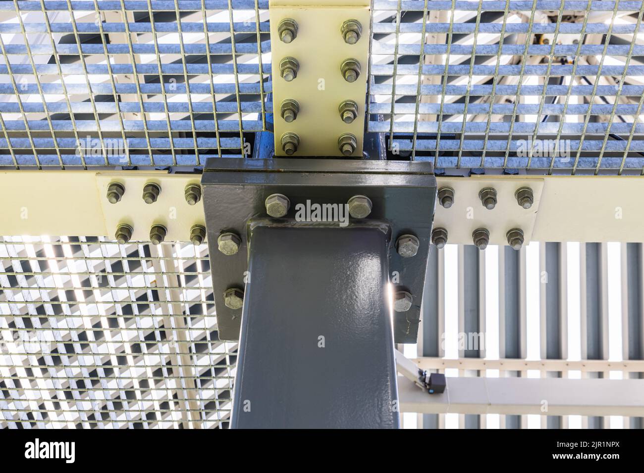 Part of a massive metal structure with bolts and rivets at the steel ...