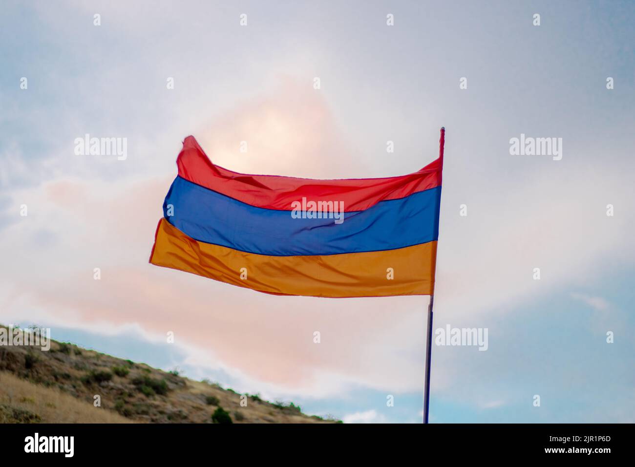 Armenian flag on blue dark sky Stock Photo - Alamy