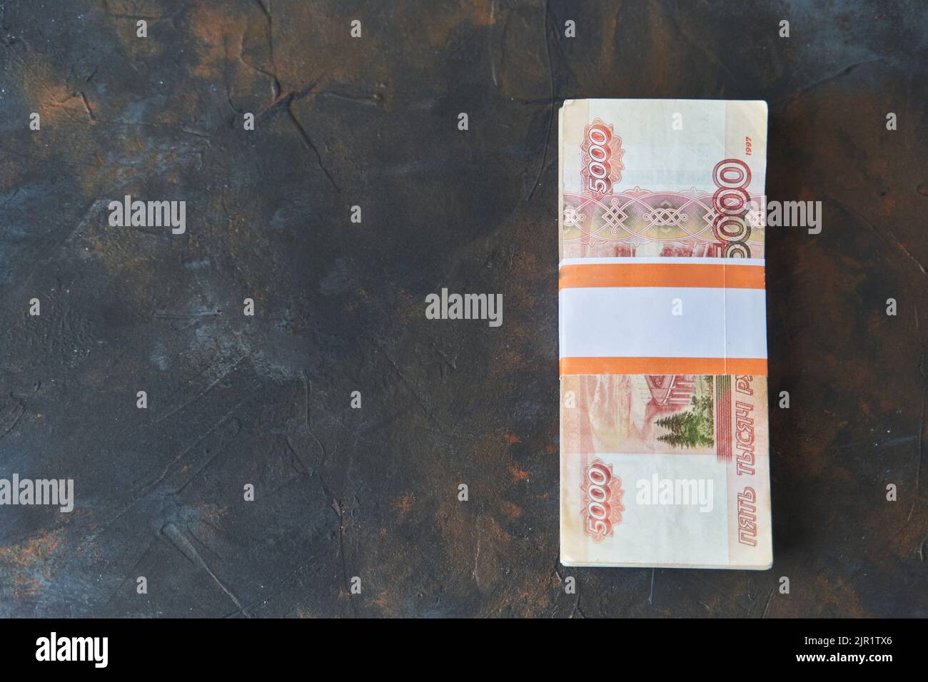 Russian rubles. A stack of five thousandth bills on a dark background ...