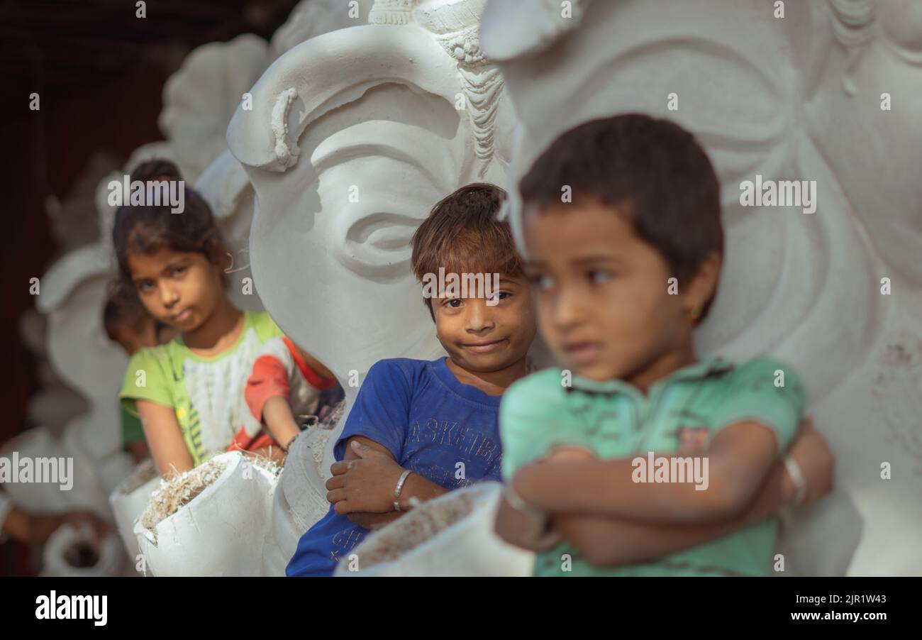 Pileru, India - July 28,2022:Kid in blue dress focus smiling. blue t ...