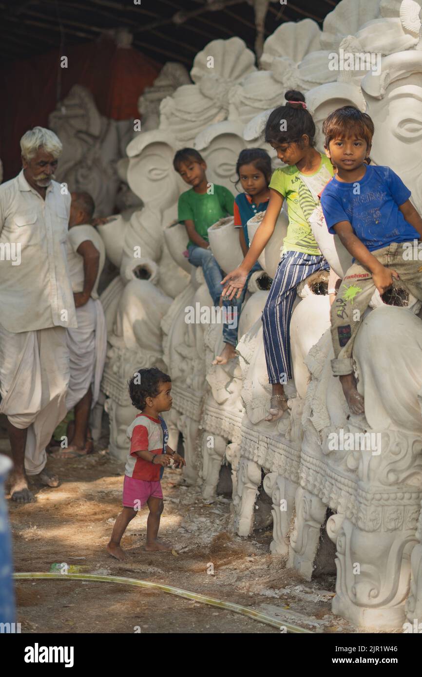 Pileru, India - July 28,2022:Girl offering hand to baby from up. Street ...