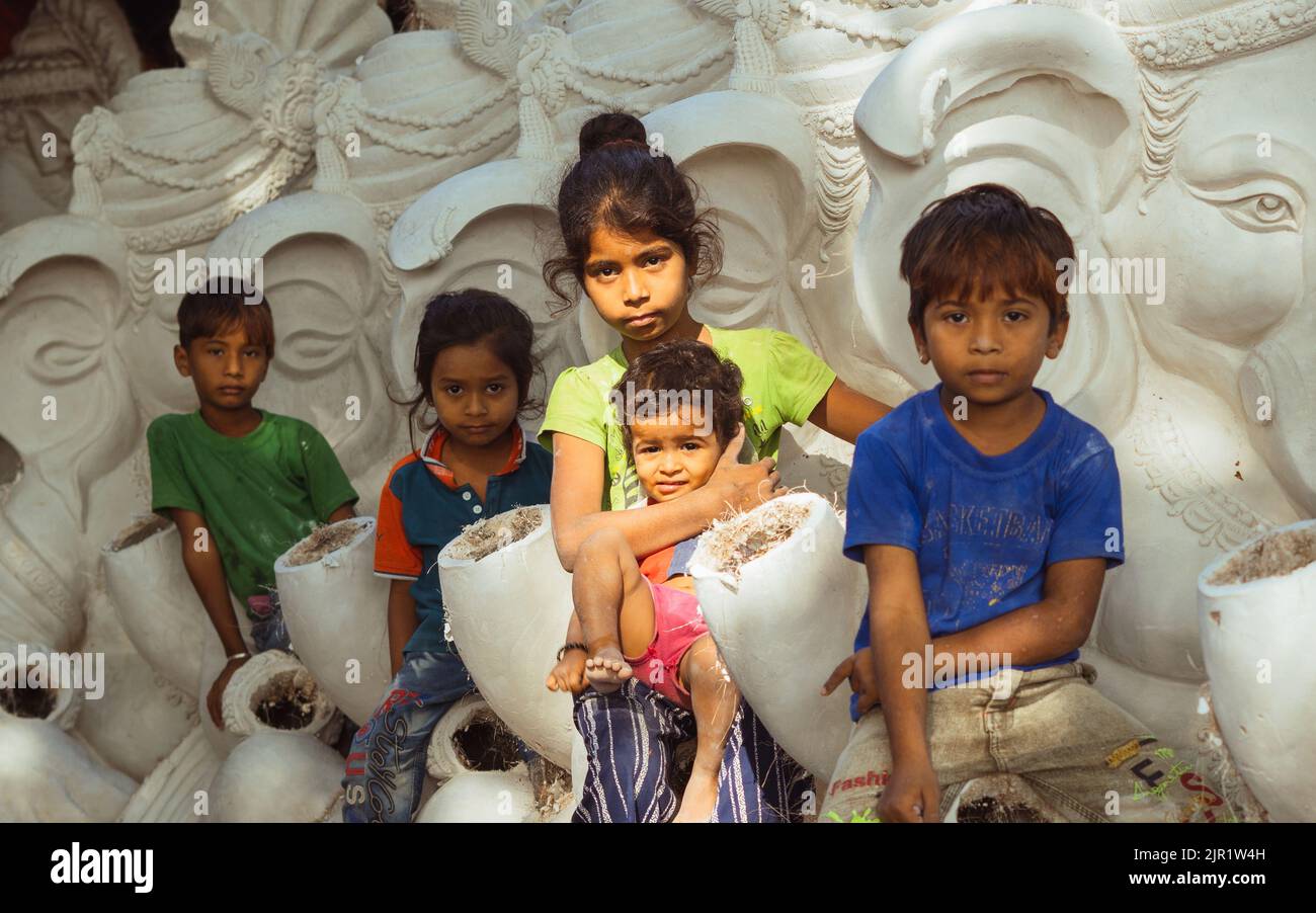 Pileru, India - July 28,2022:Indian street kids posing on ganesha idols ...