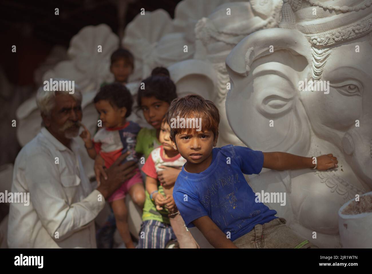 Pileru, India - July 28,2022:Boy leaning side on ganesha idols for ...
