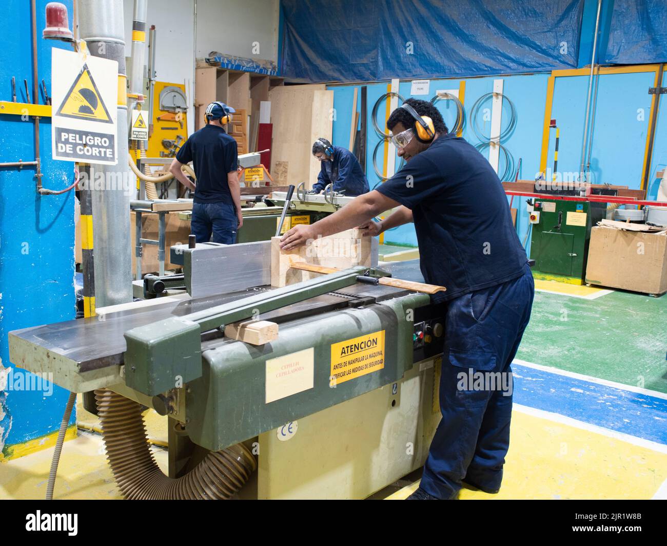 Carpenter man using mechanical planer tool in carpentry Stock Photo - Alamy