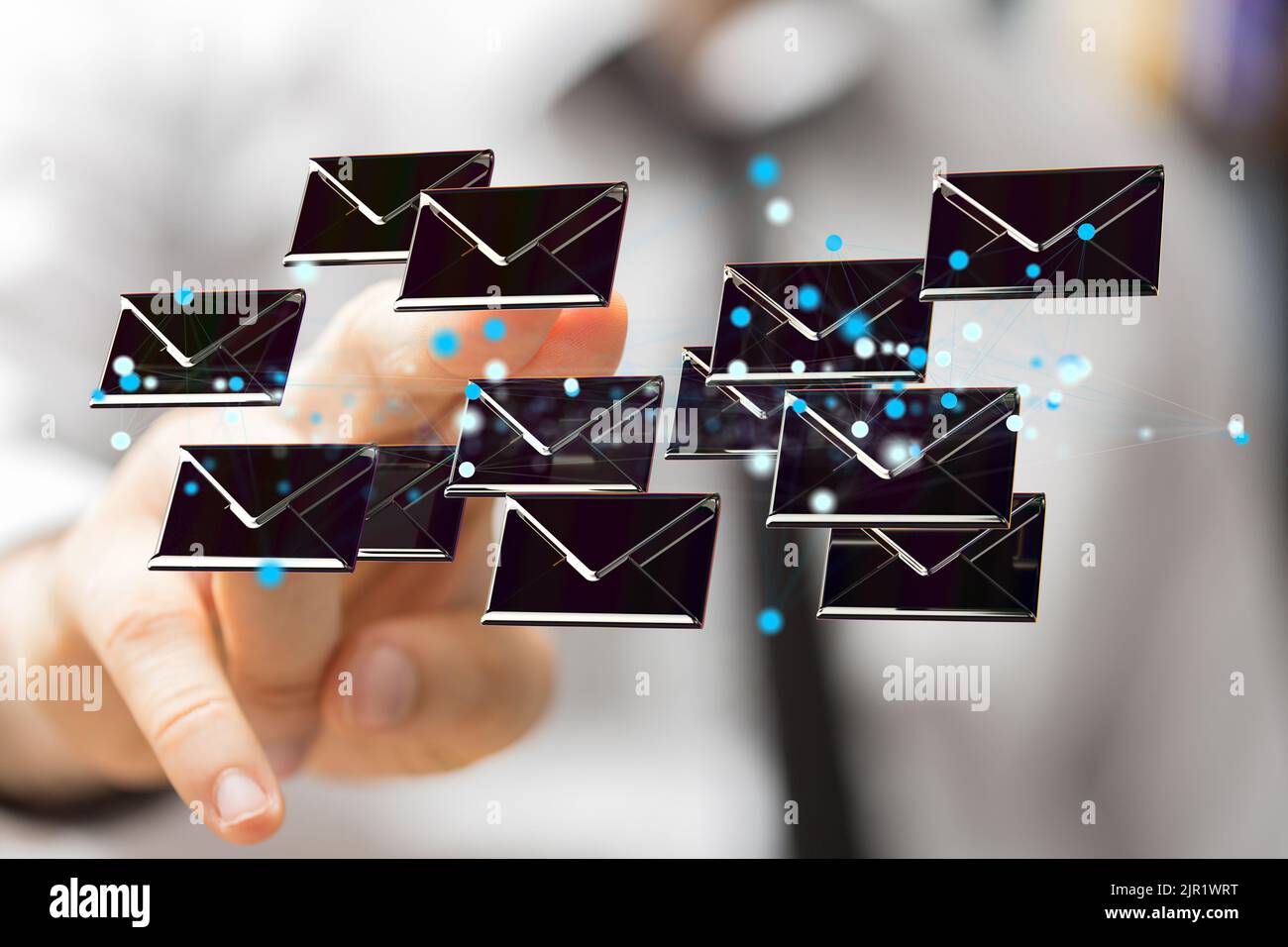 A closeup of a male hand touching email icons - email and communication ...