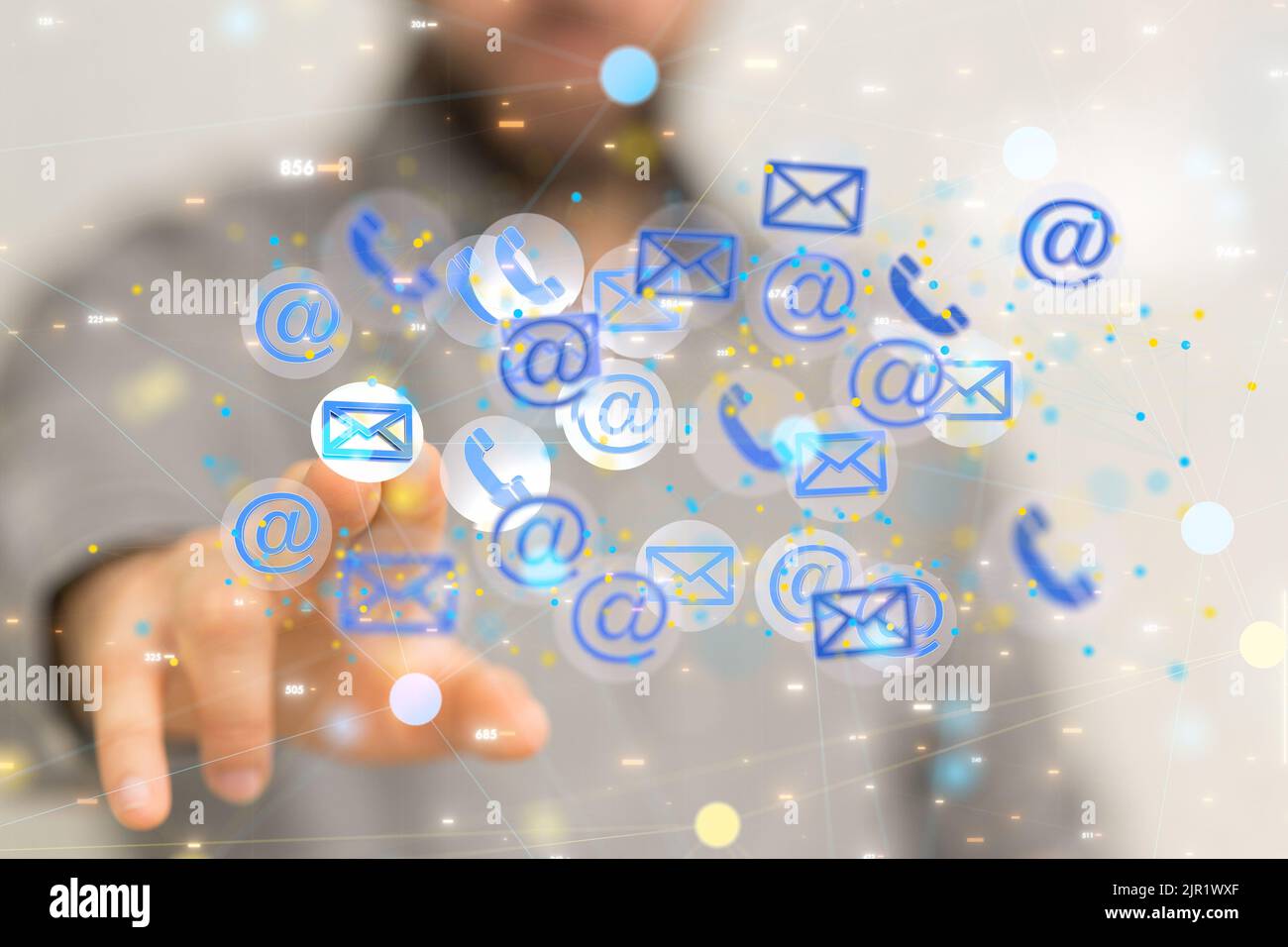 A closeup of a male hand touching email icons - email and communication ...