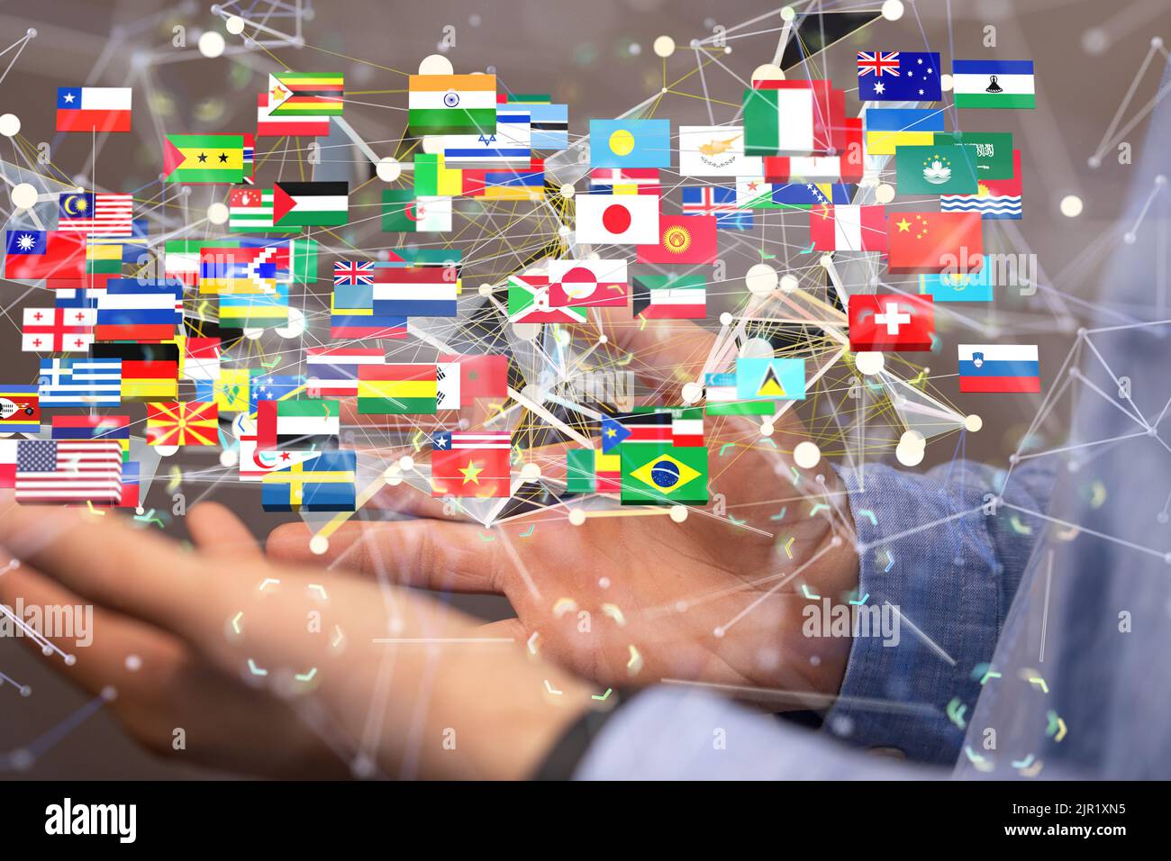 The flags of the world countries over a person's hand. Globalization ...