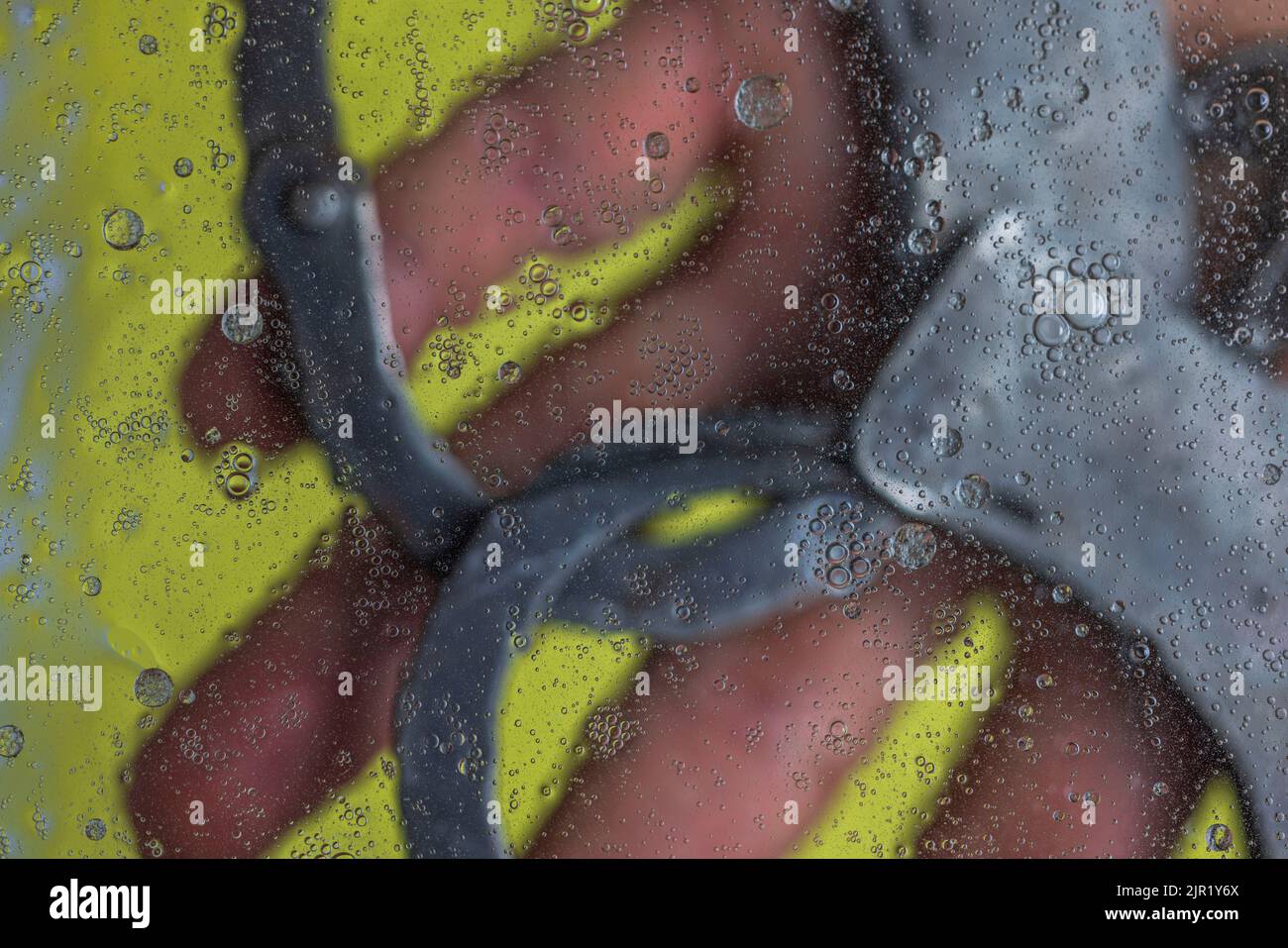 Close up view of abstraction texture of human hands and handcuffs ...