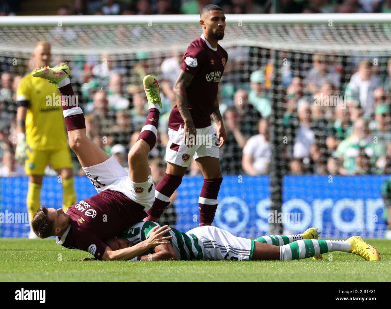 Heart of Midlothian's Alan Forrest collides with Celtic's Moritz Jenz ...