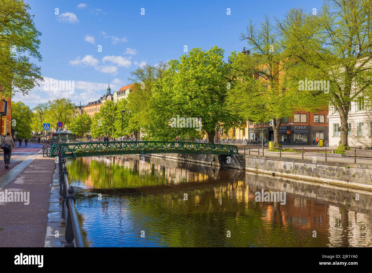Beautiful city landscape view with small bridge decorated with colorful ...