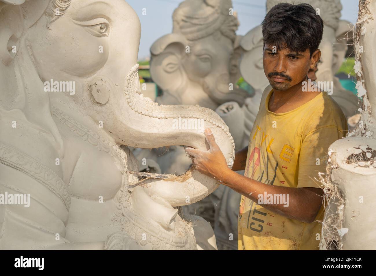 Pileru, India - July 28,2022: Young artist sculpting the ganesha idol ...