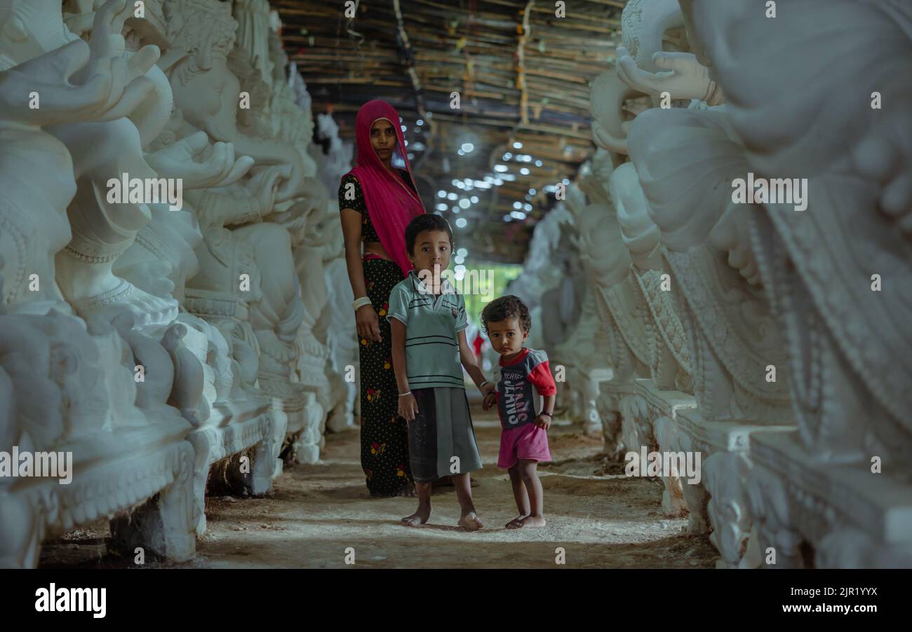 Pileru, India - July 28,2022:Indian mother with their 2 kids standing ...
