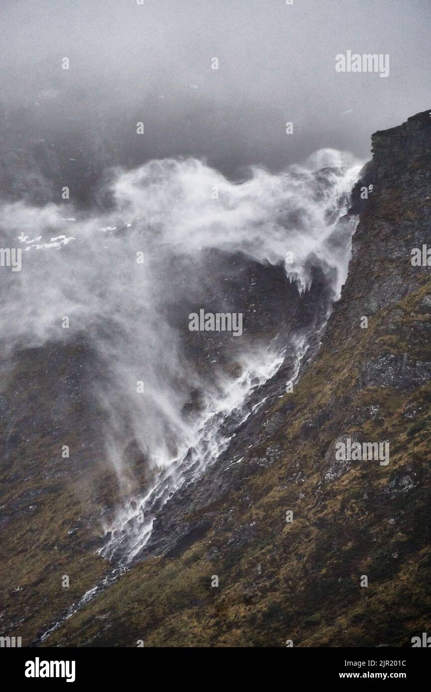 The waterfall on Alnes during a winter storm, Godøy, Sunnmøre, Møre og ...